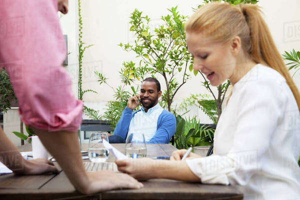 Colleagues chatting - Royalty-free Stock Photo | Dissolve