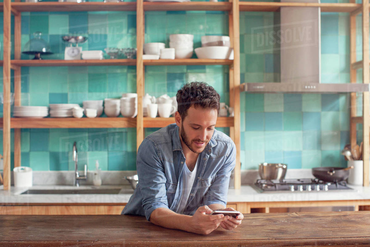 Man using smartphone - Stock Photo - Dissolve