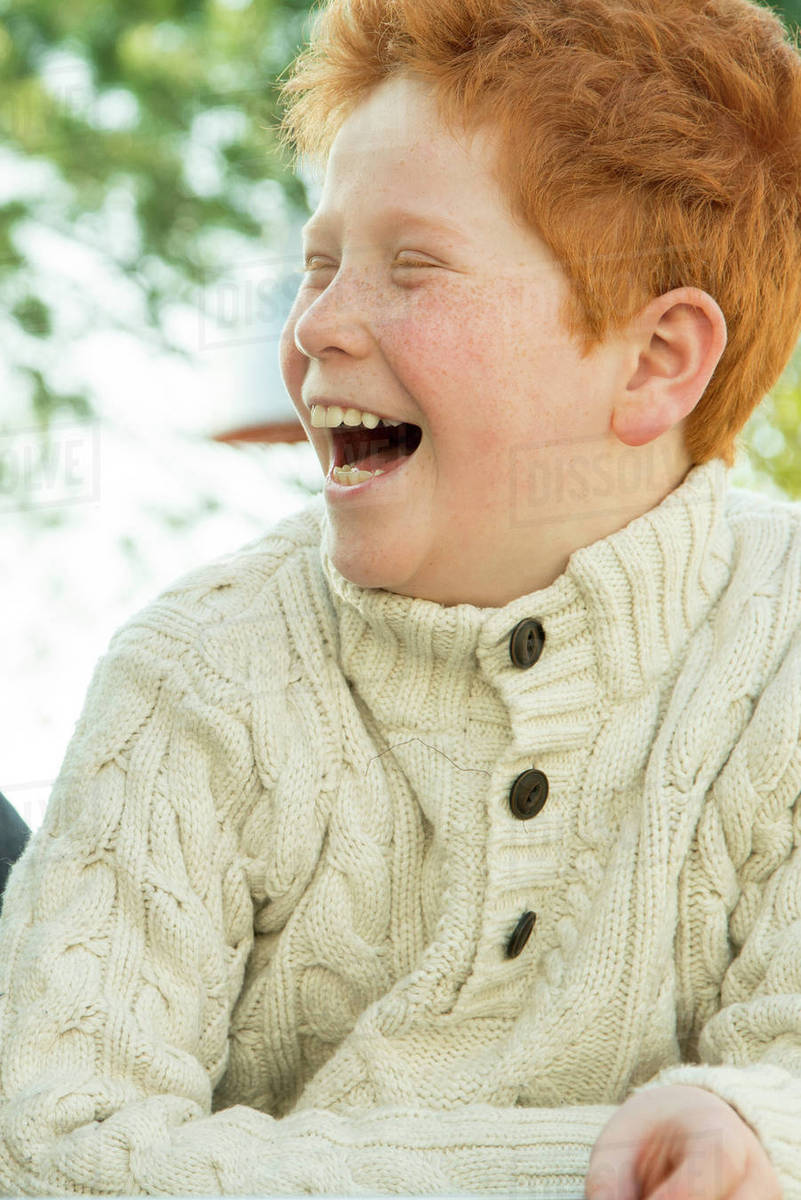 Father and son laughing together outdoors - Stock Photo - Dissolve