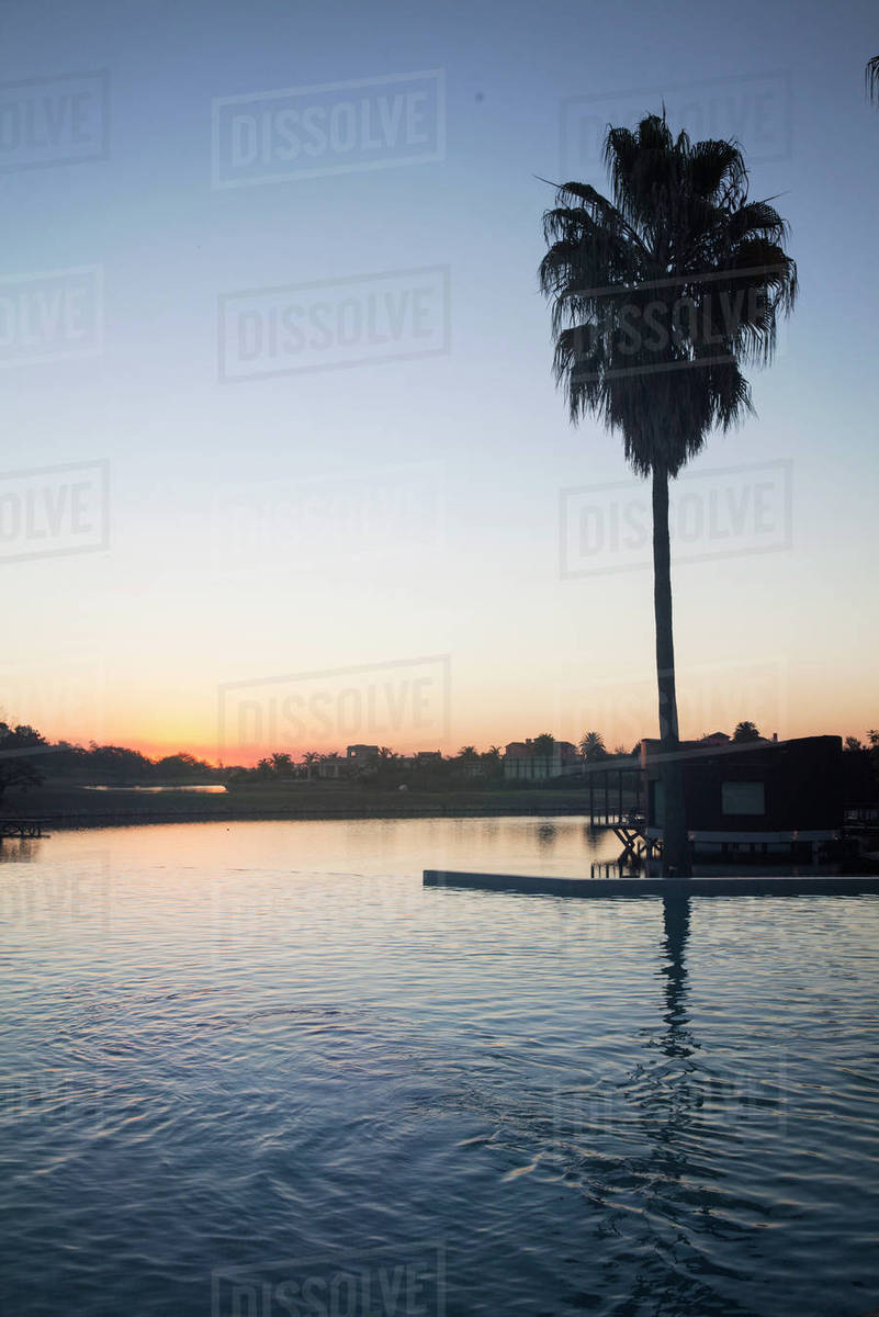 Tranquil sunset over lake - Royalty-free Stock Photo | Dissolve