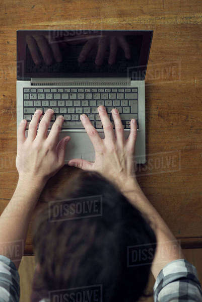 Man typing furiously on laptop computer - Royalty-free Stock Photo ...