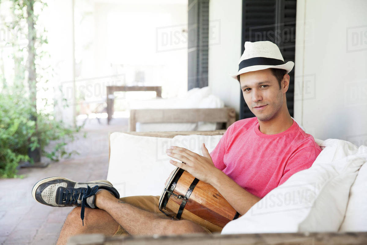 Man playing conga - Stock Photo - Dissolve