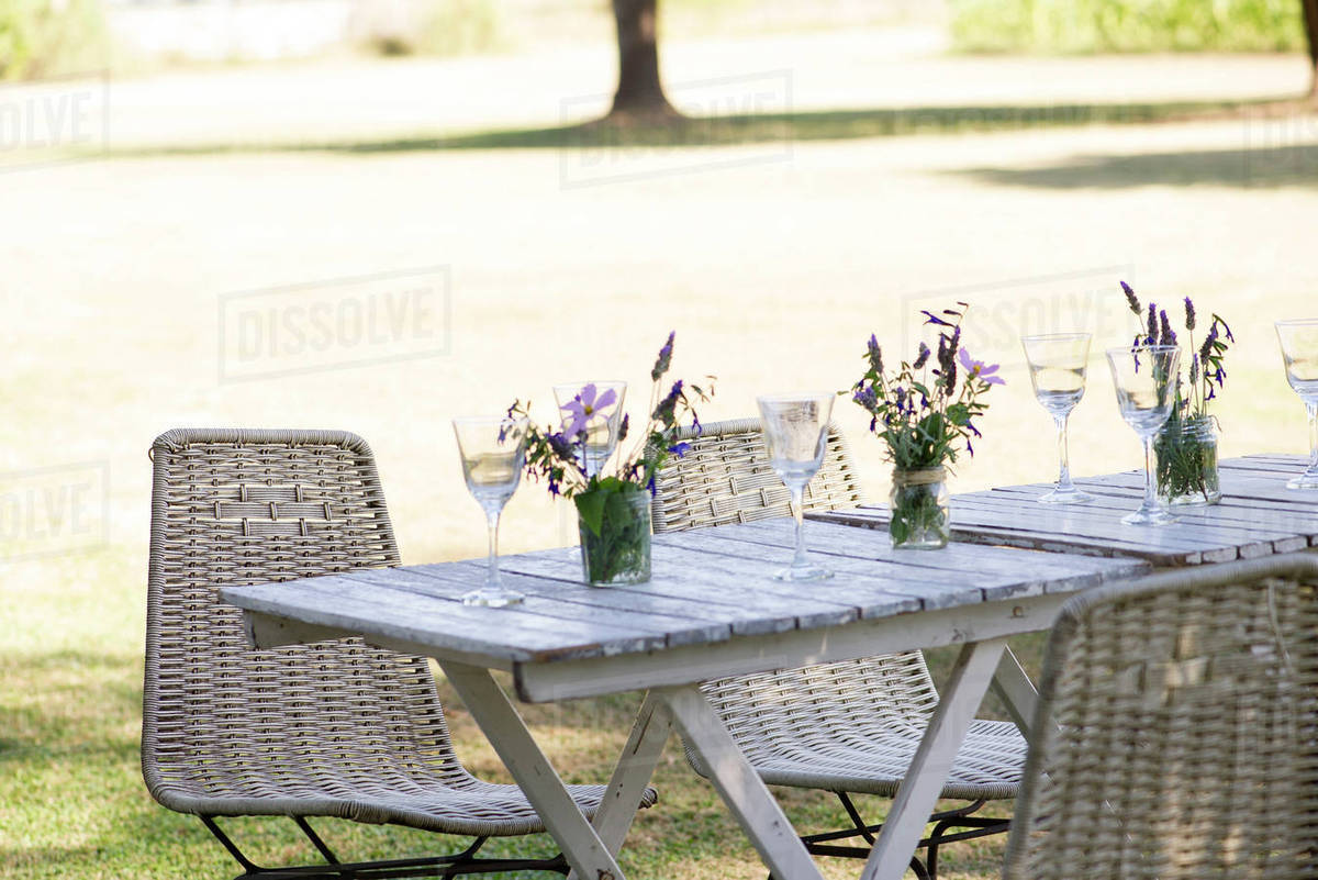 Picnic table in park set for picnic - Stock Photo - Dissolve