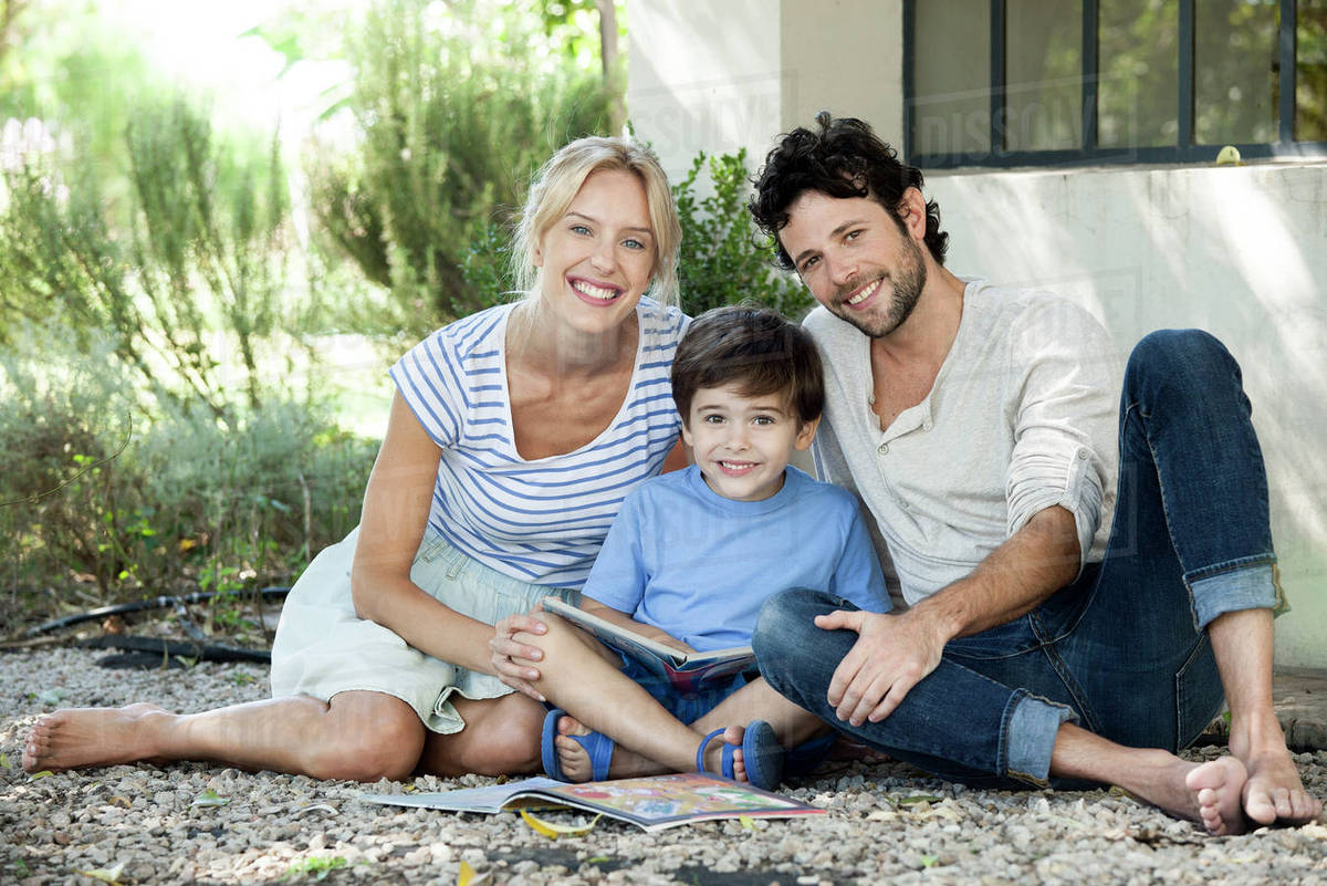 Parents with one child, portrait - Stock Photo - Dissolve