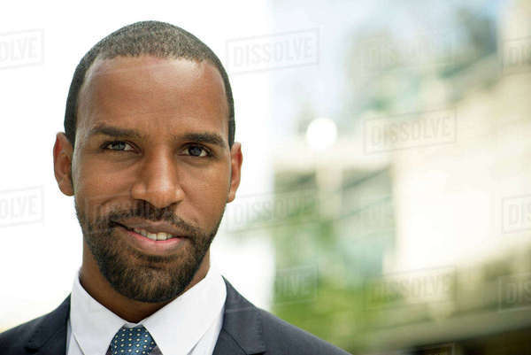 Businessman smiling, portrait - Royalty-free Stock Photo | Dissolve