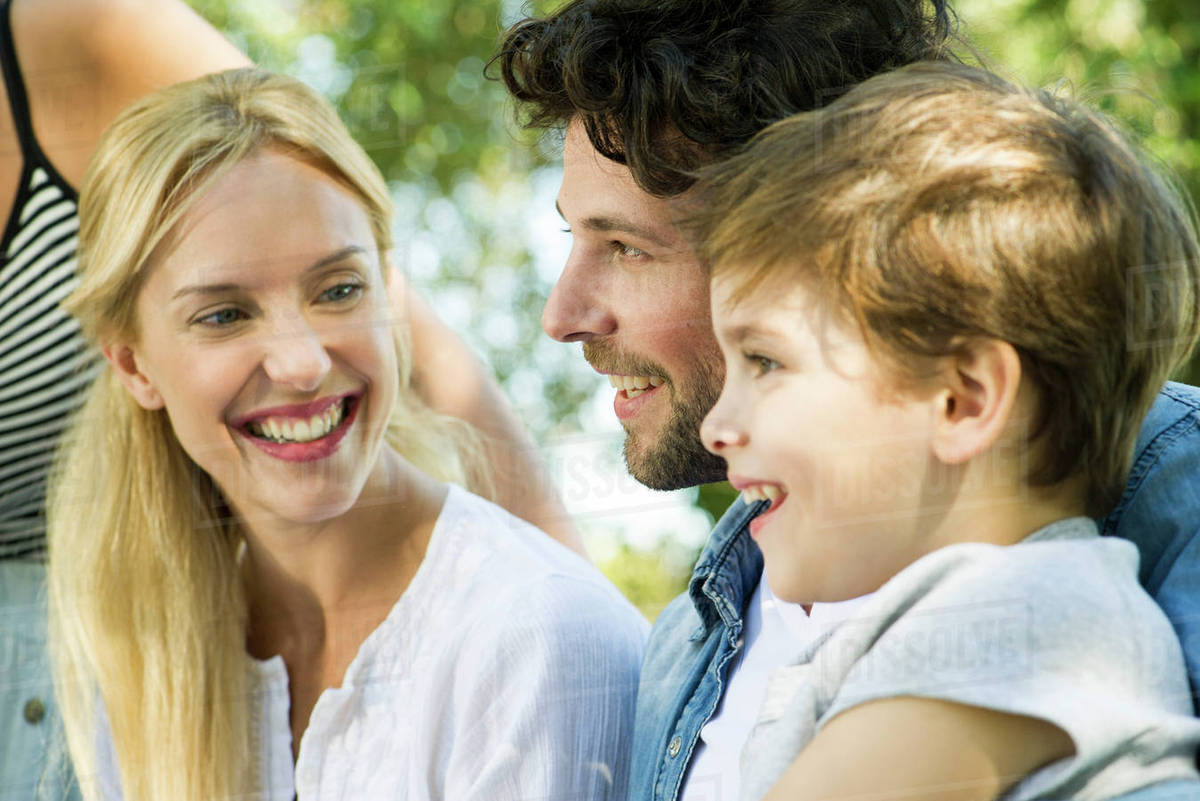 Family with one child, portrait - Stock Photo - Dissolve