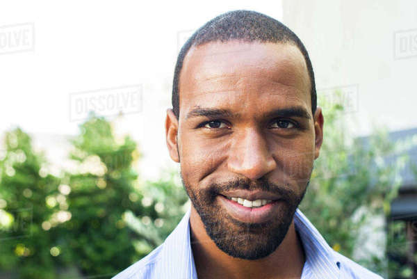 Man smiling, portrait - Royalty-free Stock Photo | Dissolve