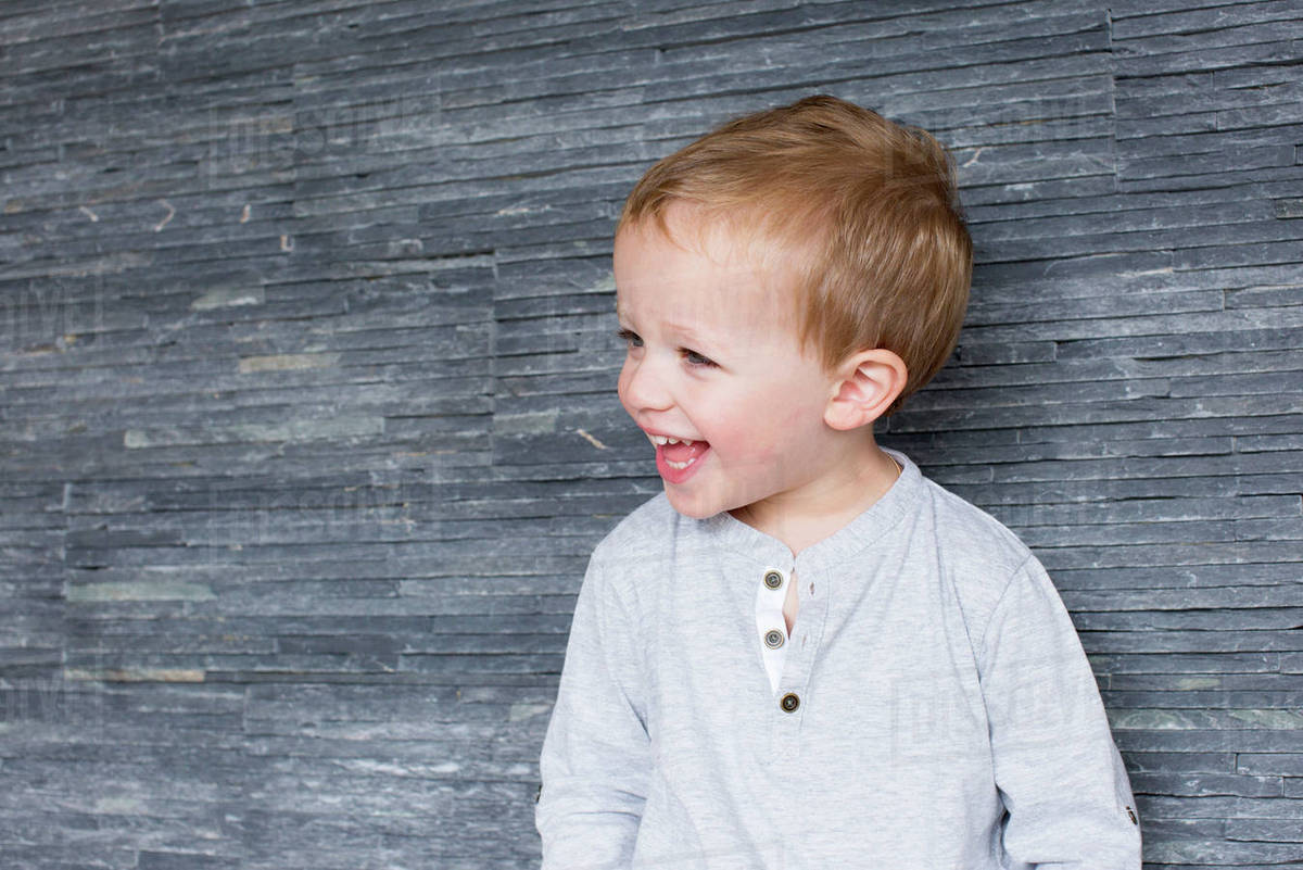 Little boy laughing - Stock Photo - Dissolve
