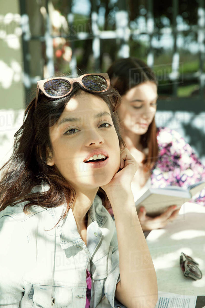 Young woman hanging out with friend outdoors - Royalty-free Stock Photo ...