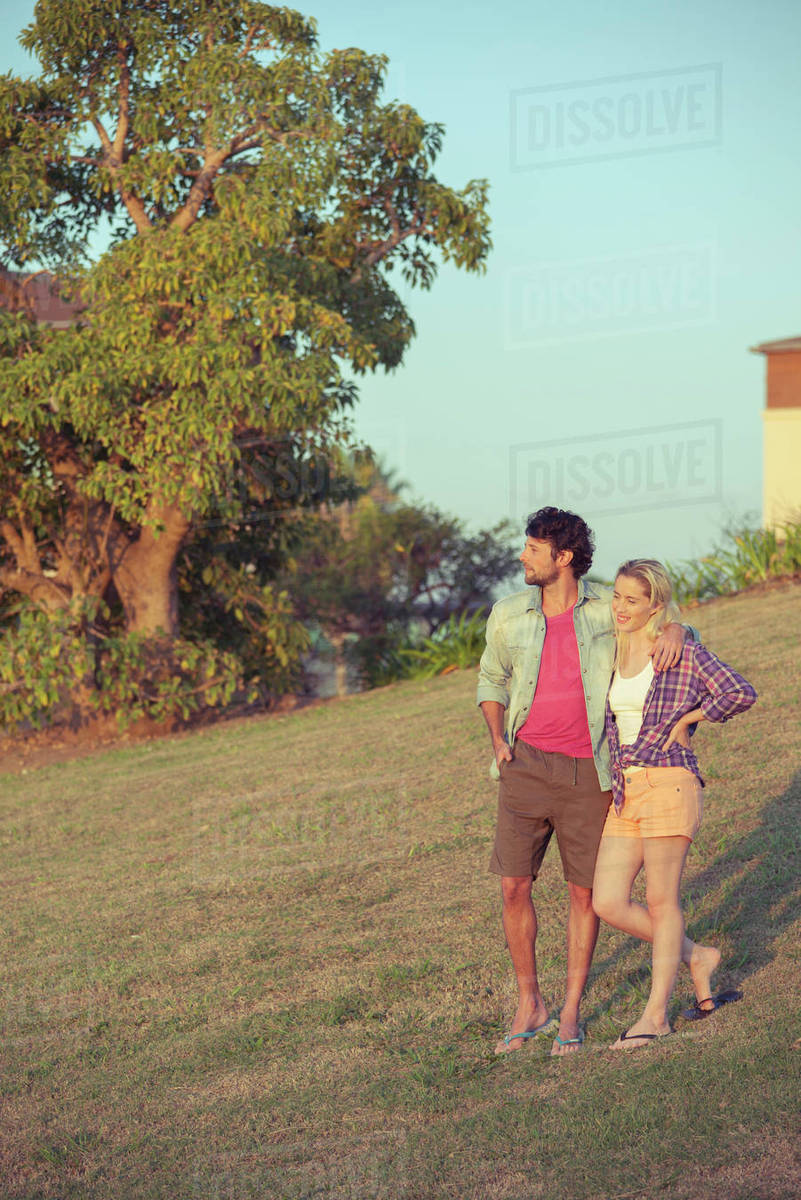 Couple strolling together in park - Royalty-free Stock Photo | Dissolve