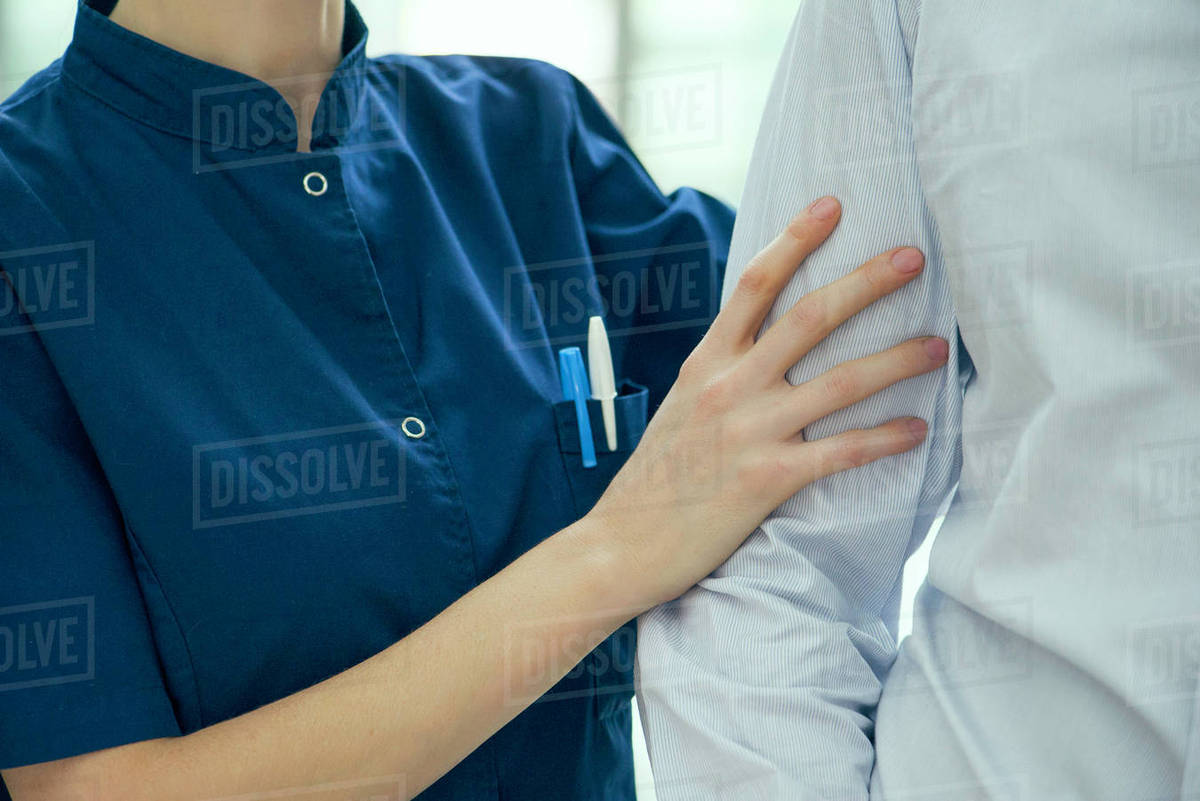 Nurse assisting patient - Royalty-free Stock Photo | Dissolve
