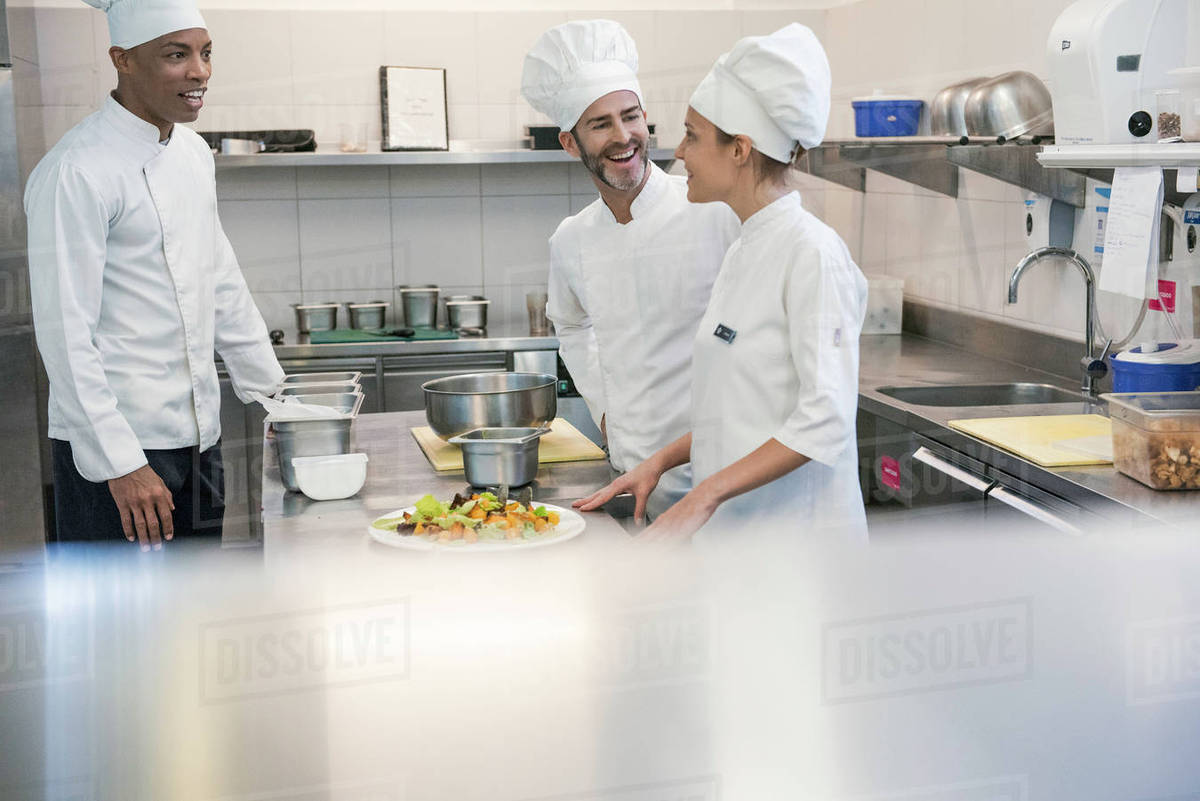 Chefs working together in commercial kitchen - Royalty-free Stock Photo ...