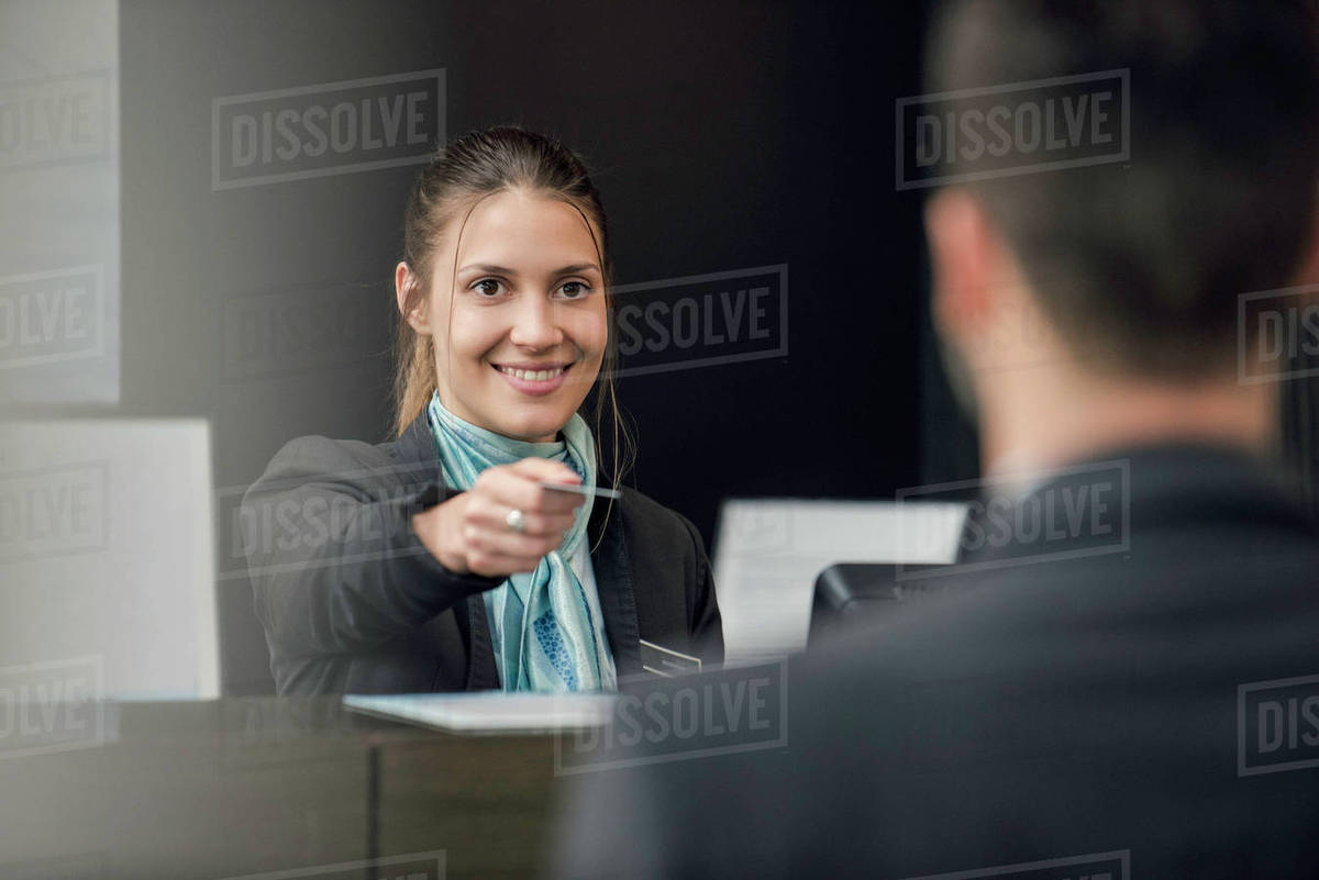 Bank teller helping customer - Stock Photo - Dissolve