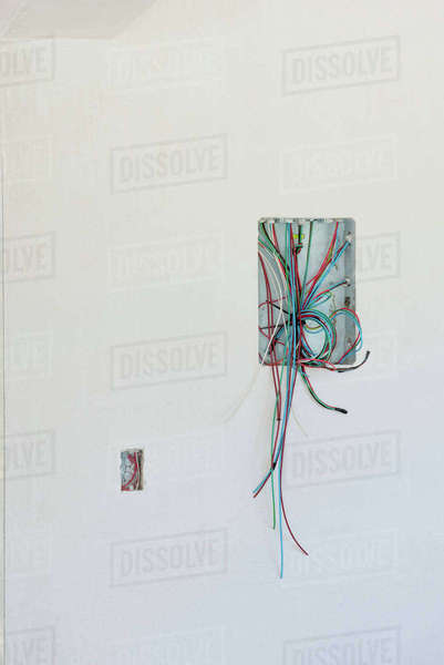 Electrical wires dangling from walls in unfinished building - Royalty ...