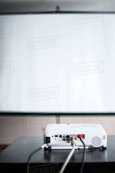 Video projector and blank screen in office or classroom - Stock Photo ...