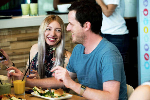 Friends having meal together at restaurant - Royalty-free Stock Photo ...
