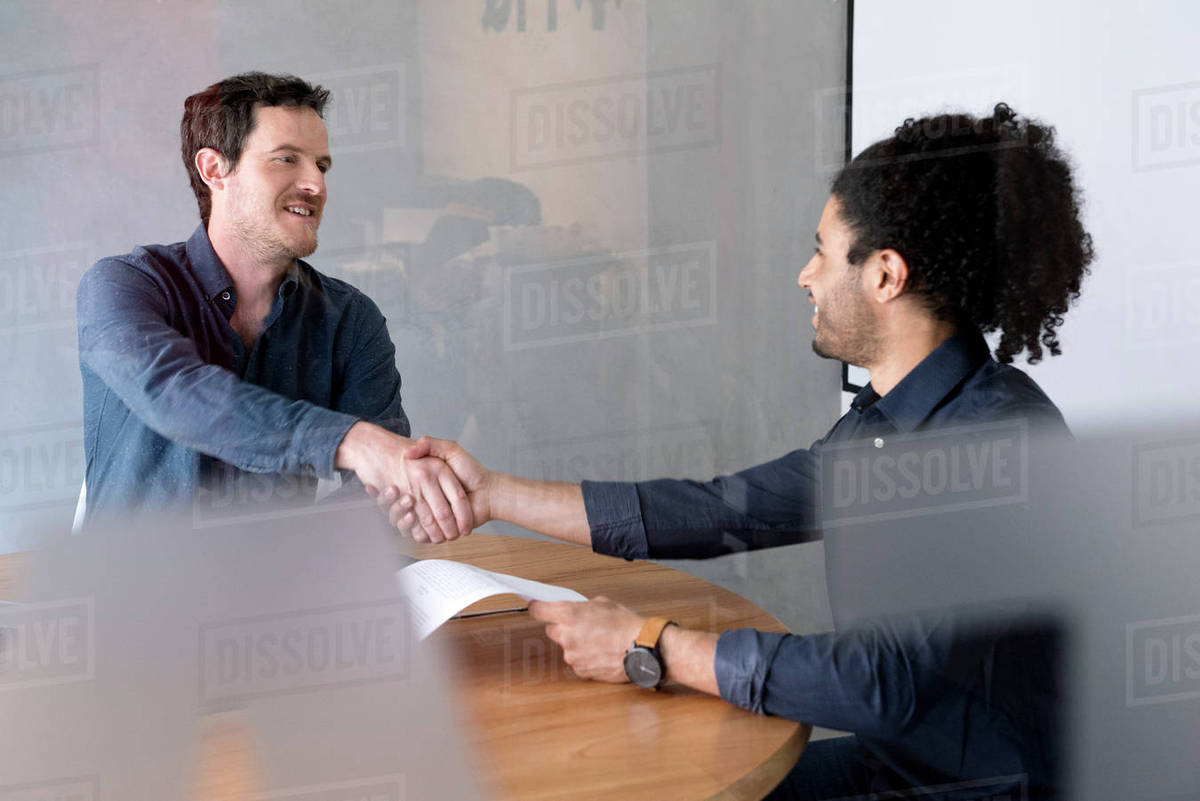 Men shaking hands - Royalty-free Stock Photo | Dissolve