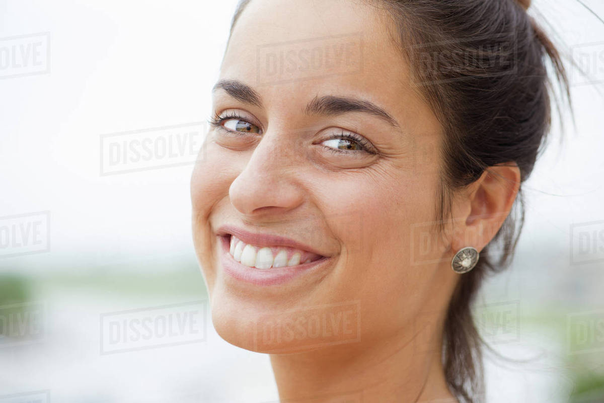 Woman smiling, portrait - Royalty-free Stock Photo | Dissolve