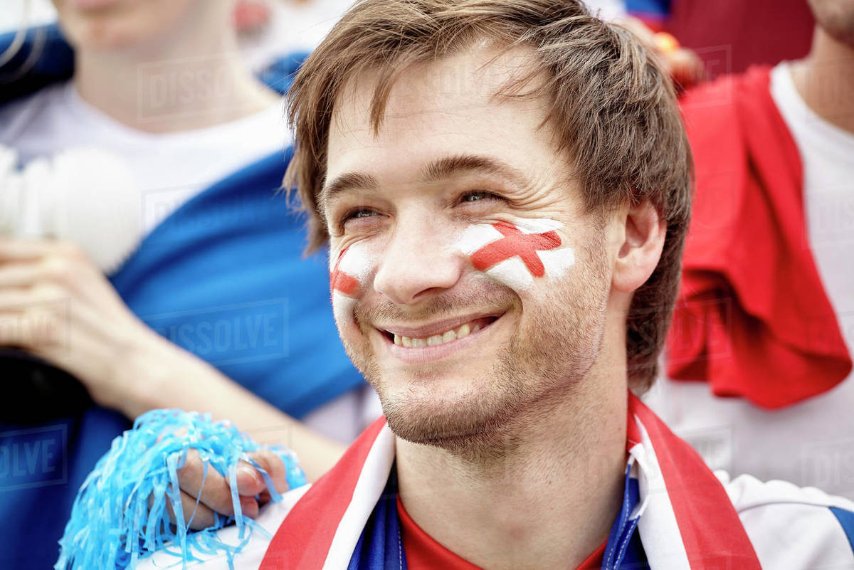 British football fan smiling cheerfully at match, portrait - Stock ...