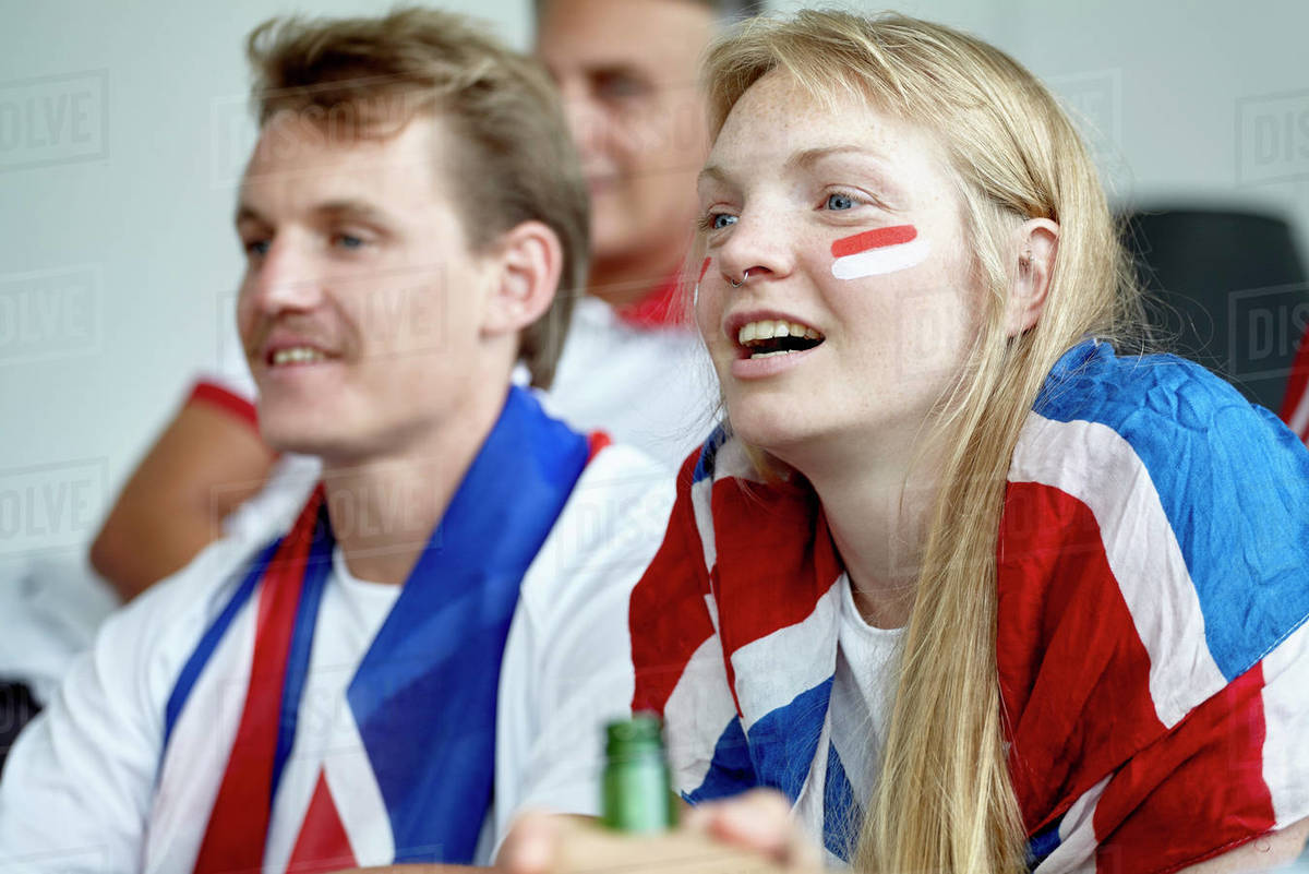 British football fans watching match at home - Stock Photo - Dissolve