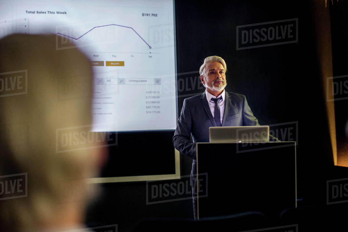 Man giving presentation - Stock Photo - Dissolve