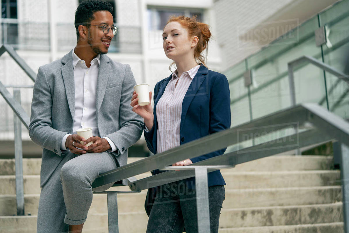 Couple talking outdoors - Stock Photo - Dissolve