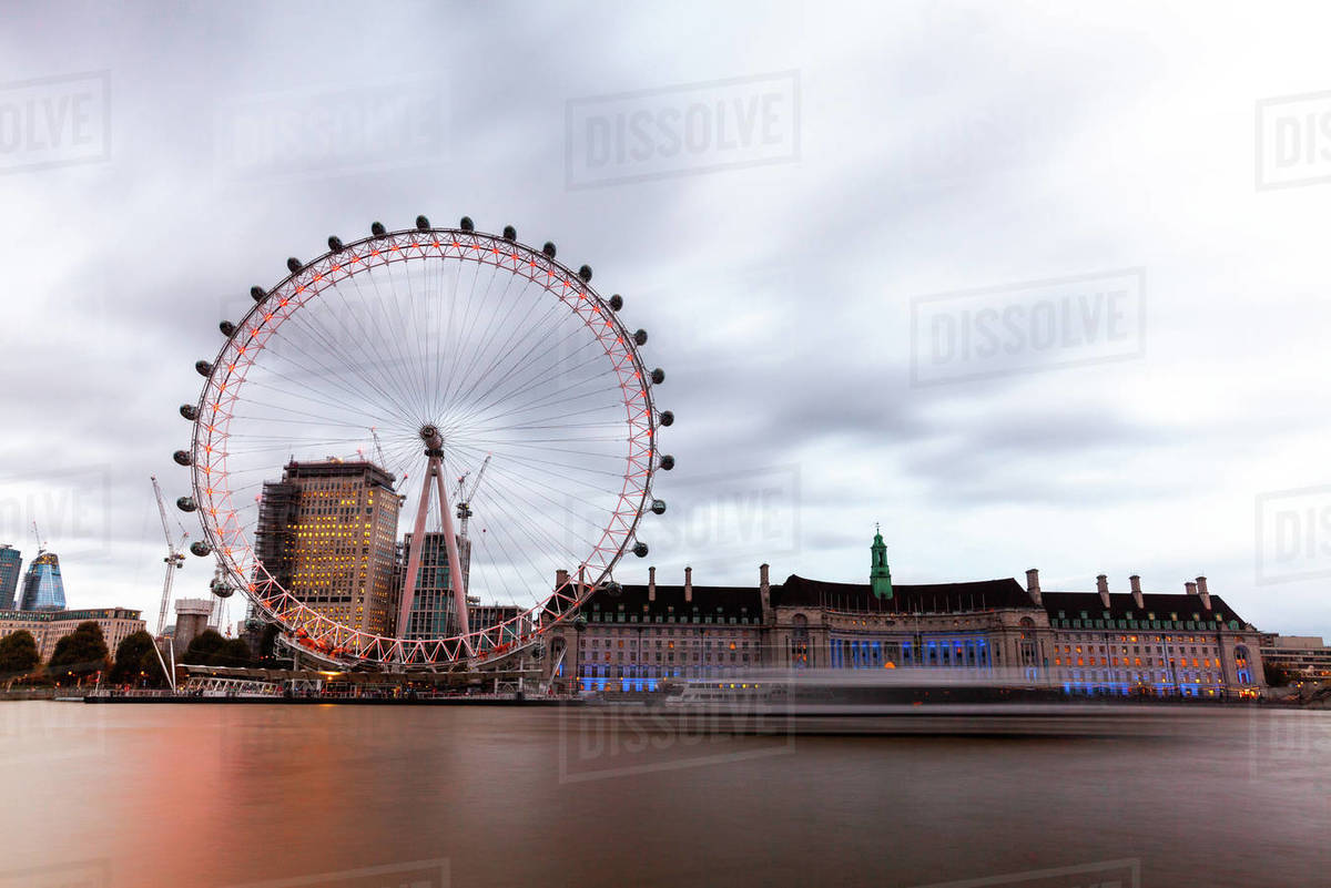 View of Millennium Wheel with cityscape at dusk - Stock Photo - Dissolve