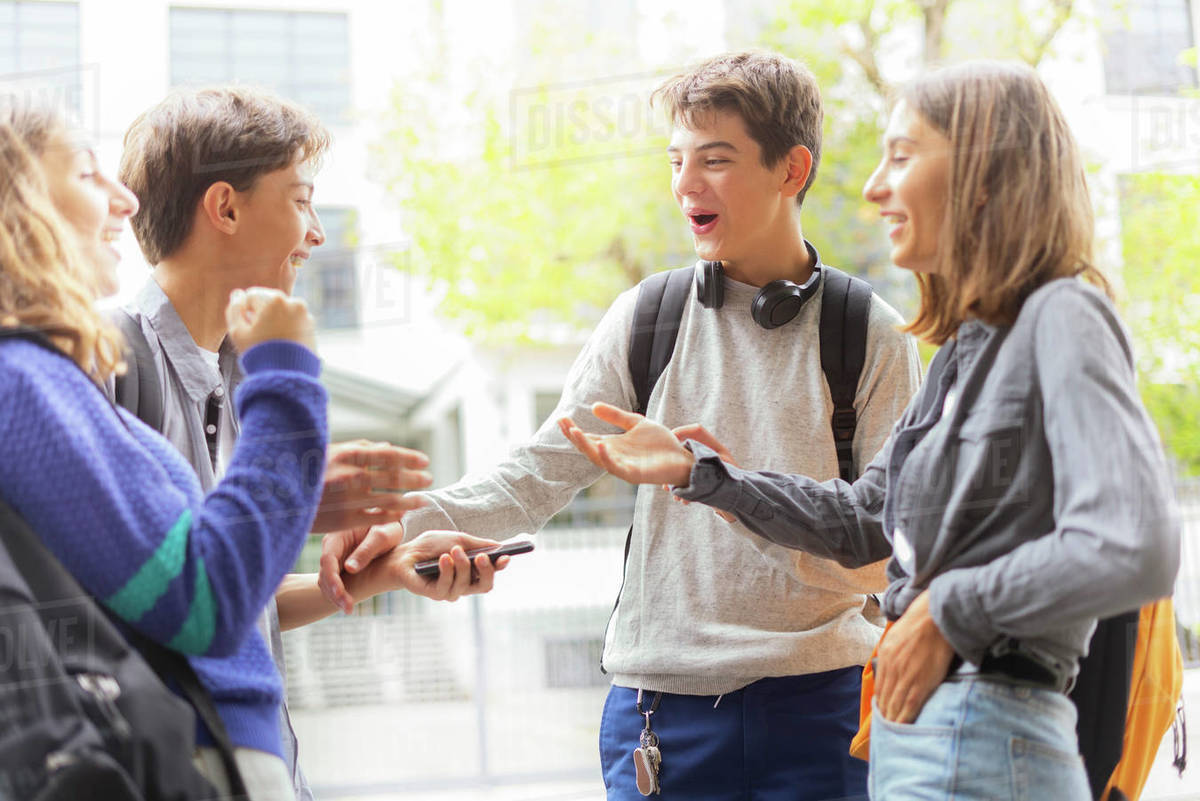 Friends talking outdoors - Stock Photo - Dissolve