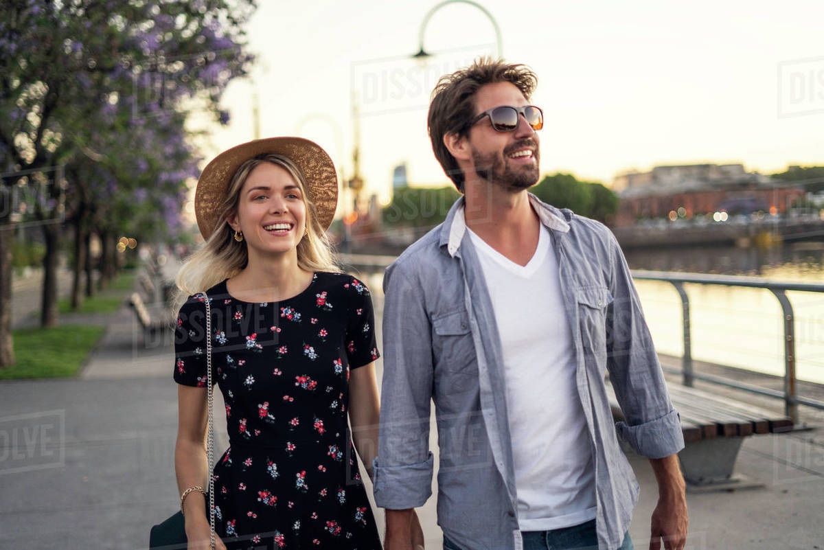 Couple walking on street - Royalty-free Stock Photo | Dissolve