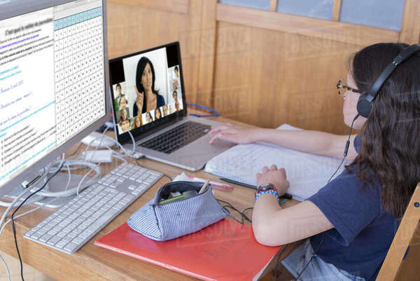 Girl attending online school classes from home - Royalty-free Stock ...
