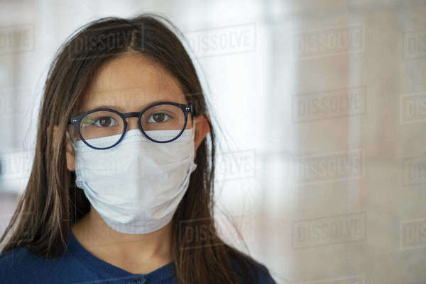 Close up of teenage girl wearing surgical mask - Royalty-free Stock ...