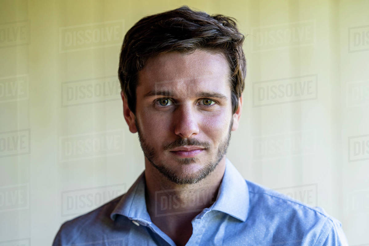 Portrait of young man standing in the house - Royalty-free Stock Photo ...