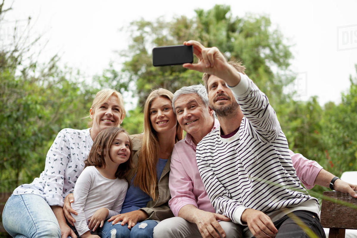 Family taking selfie - Stock Photo - Dissolve