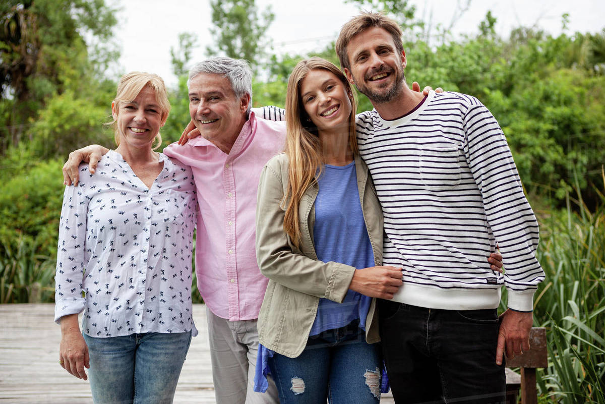 Portrait of happy family standing together - Royalty-free Stock Photo ...