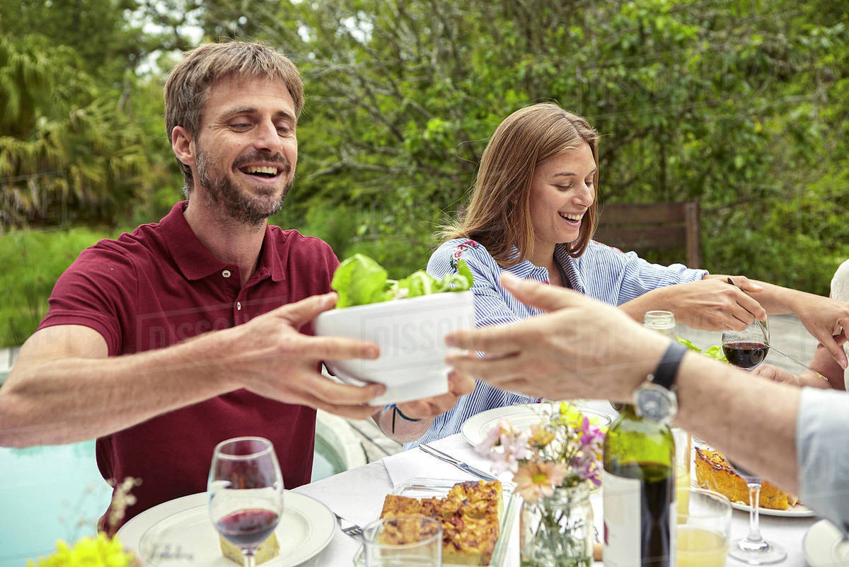 Happy family having meal - Royalty-free Stock Photo | Dissolve