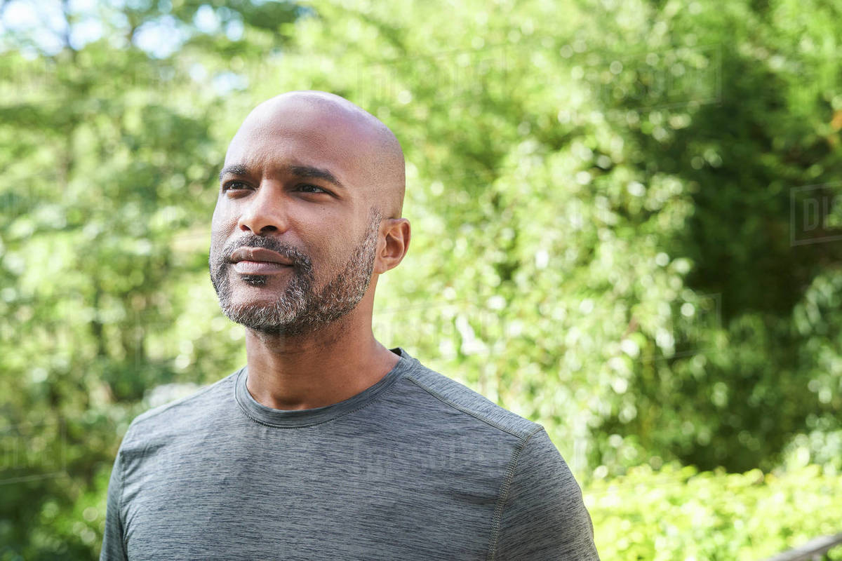 Man standing in garden - Royalty-free Stock Photo | Dissolve