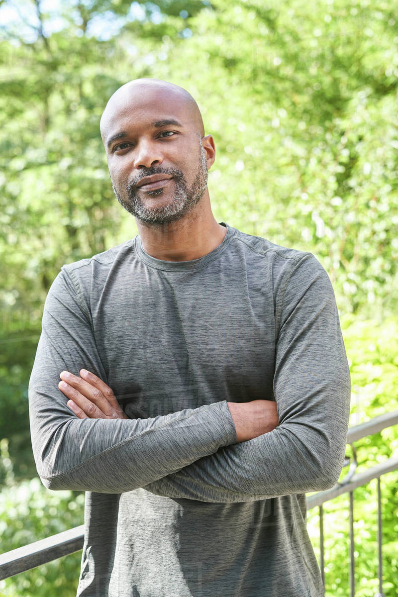 Close-up of man standing in garden - Royalty-free Stock Photo | Dissolve
