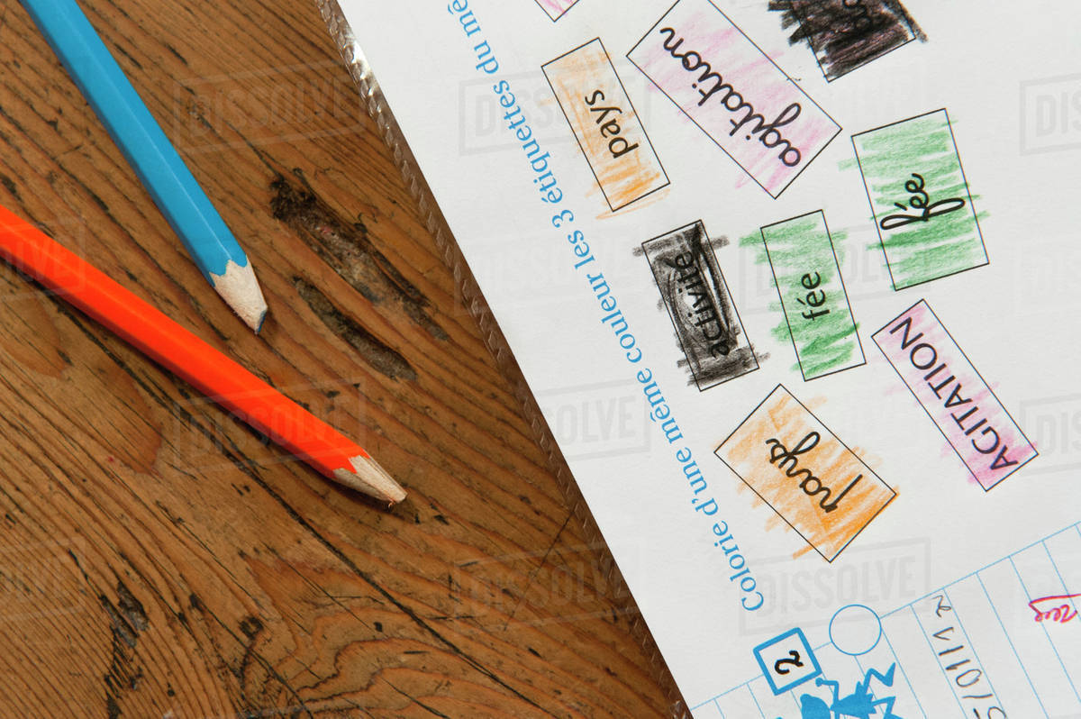 Child's homework and colored pencils - Royalty-free Stock Photo | Dissolve