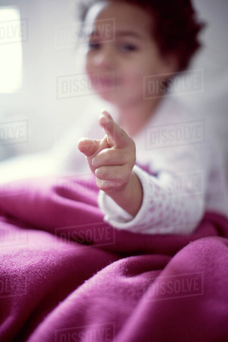 Little girl pointing at camera - Royalty-free Stock Photo | Dissolve