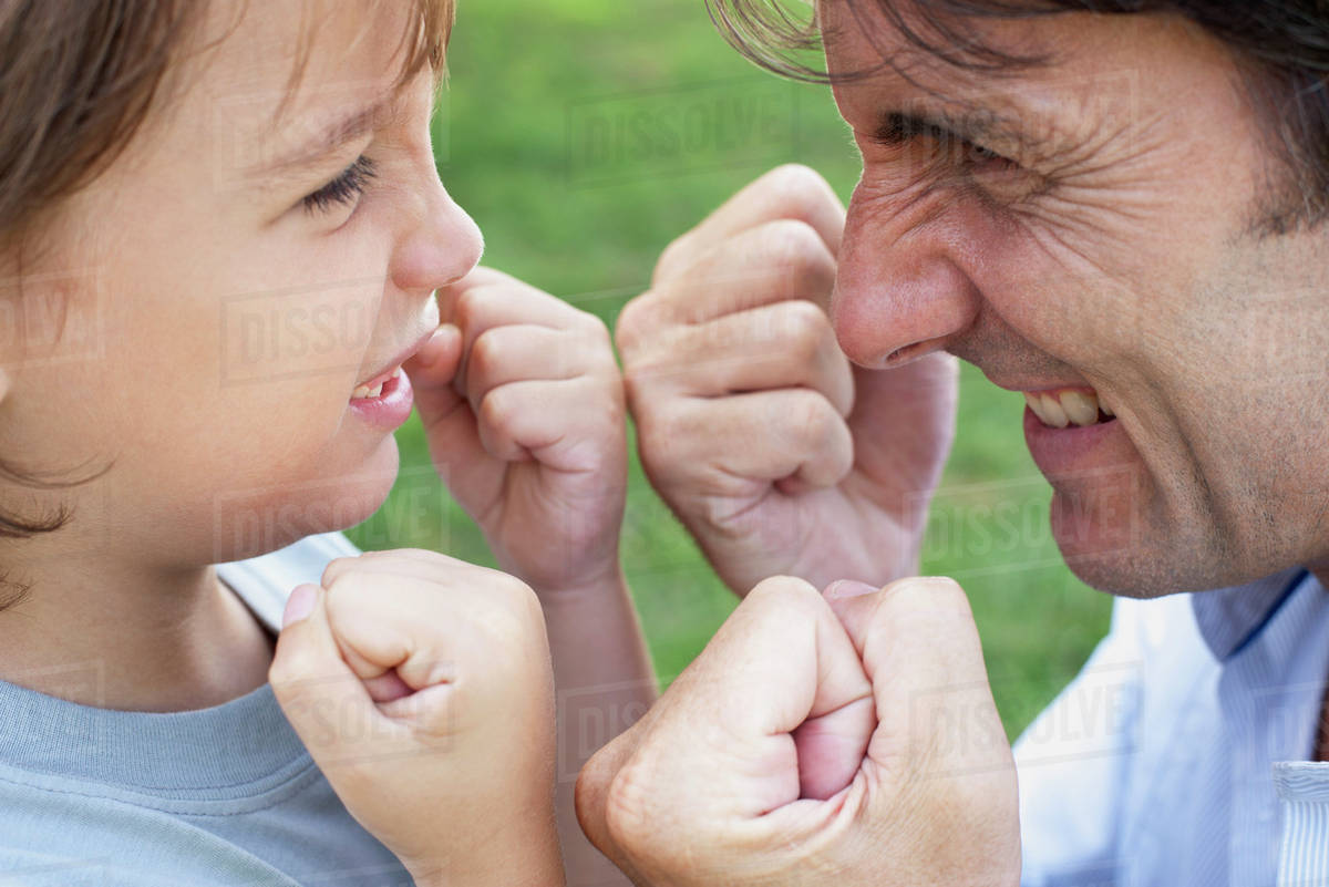 Father and son playfighting - Royalty-free Stock Photo | Dissolve