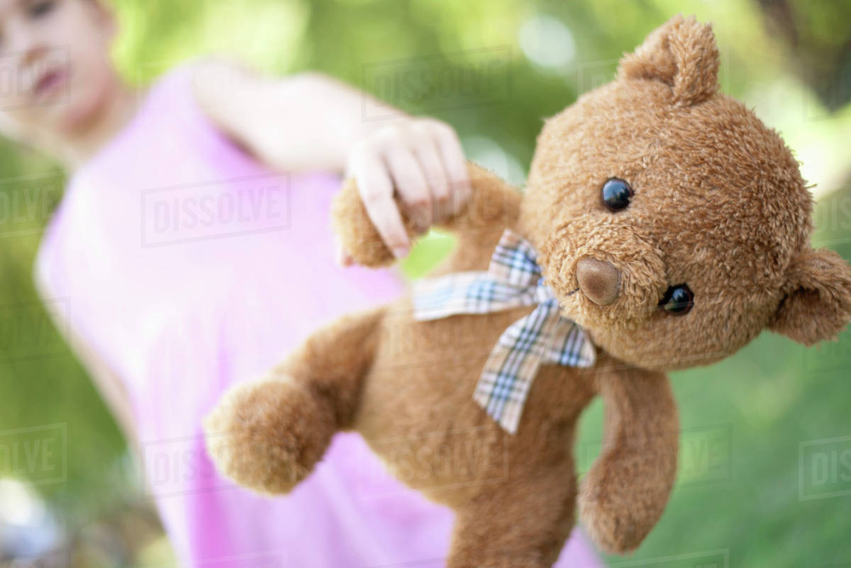 Girl holding teddy bear, low angle view - Royalty-free Stock Photo ...