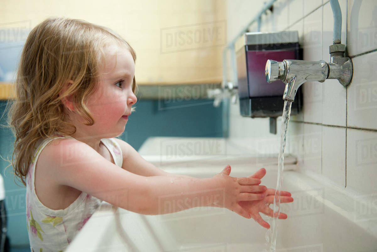 Little girl washing hands - Royalty-free Stock Photo | Dissolve
