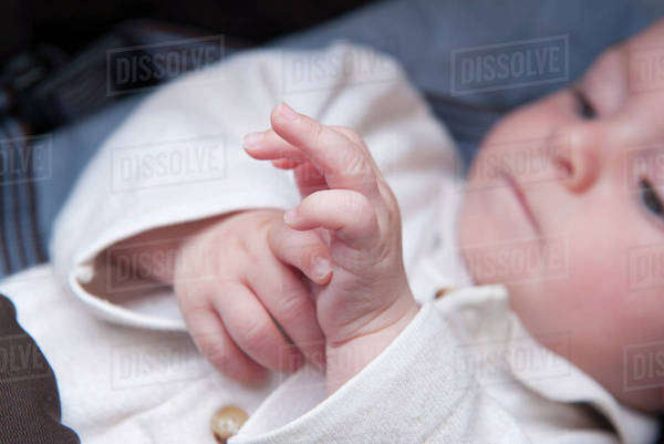 Baby's hands clasped - Royalty-free Stock Photo | Dissolve