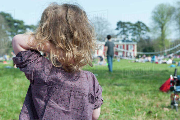 Little girl outdoors, rear view - Royalty-free Stock Photo | Dissolve