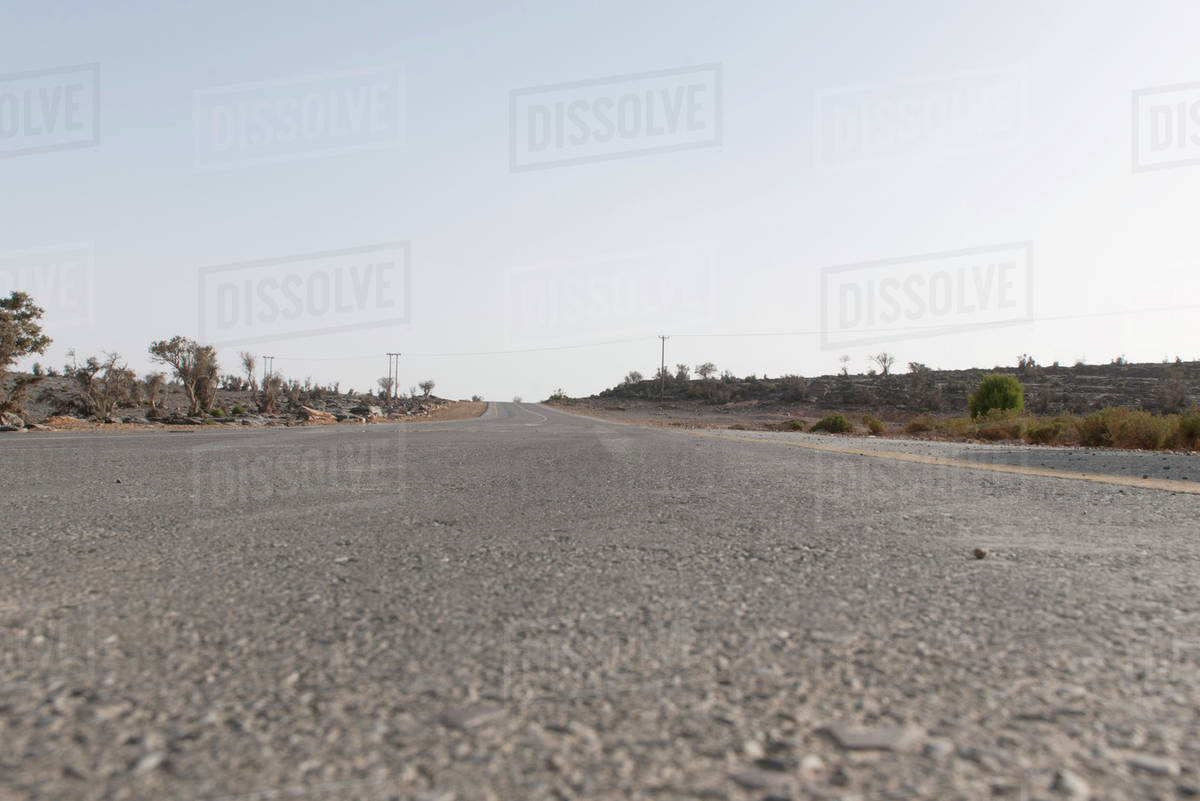 Road through arid landscape - Royalty-free Stock Photo | Dissolve