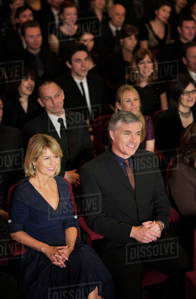 Smiling audience watching performance in theater - Royalty-free Stock ...
