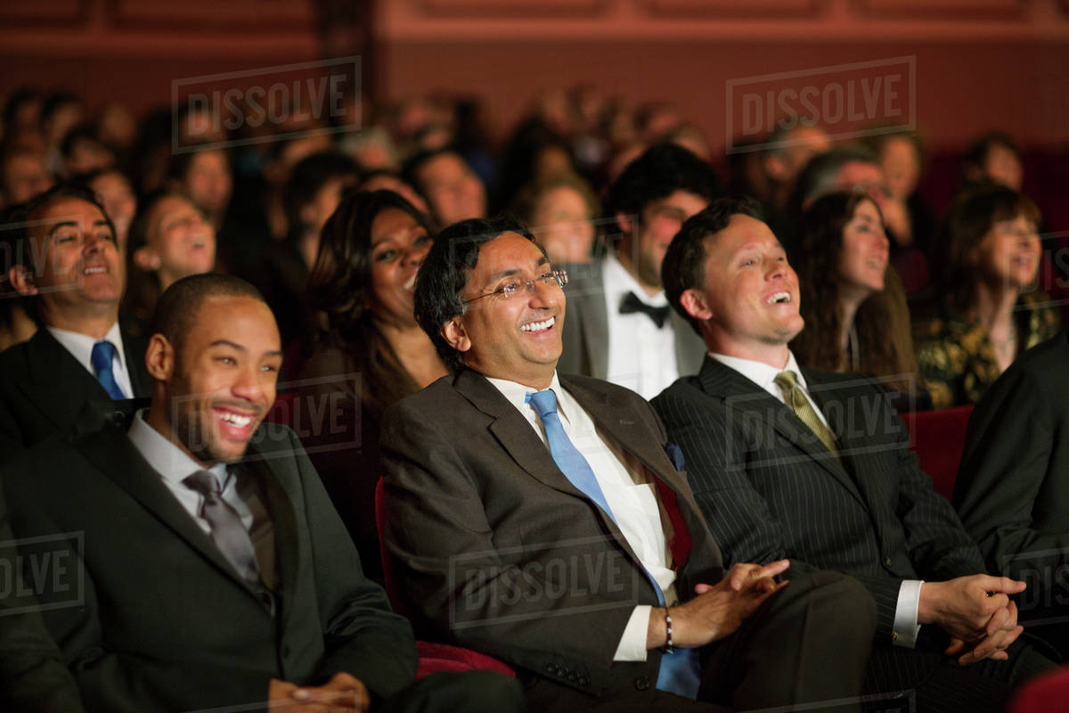 Laughing theater audience - Stock Photo - Dissolve