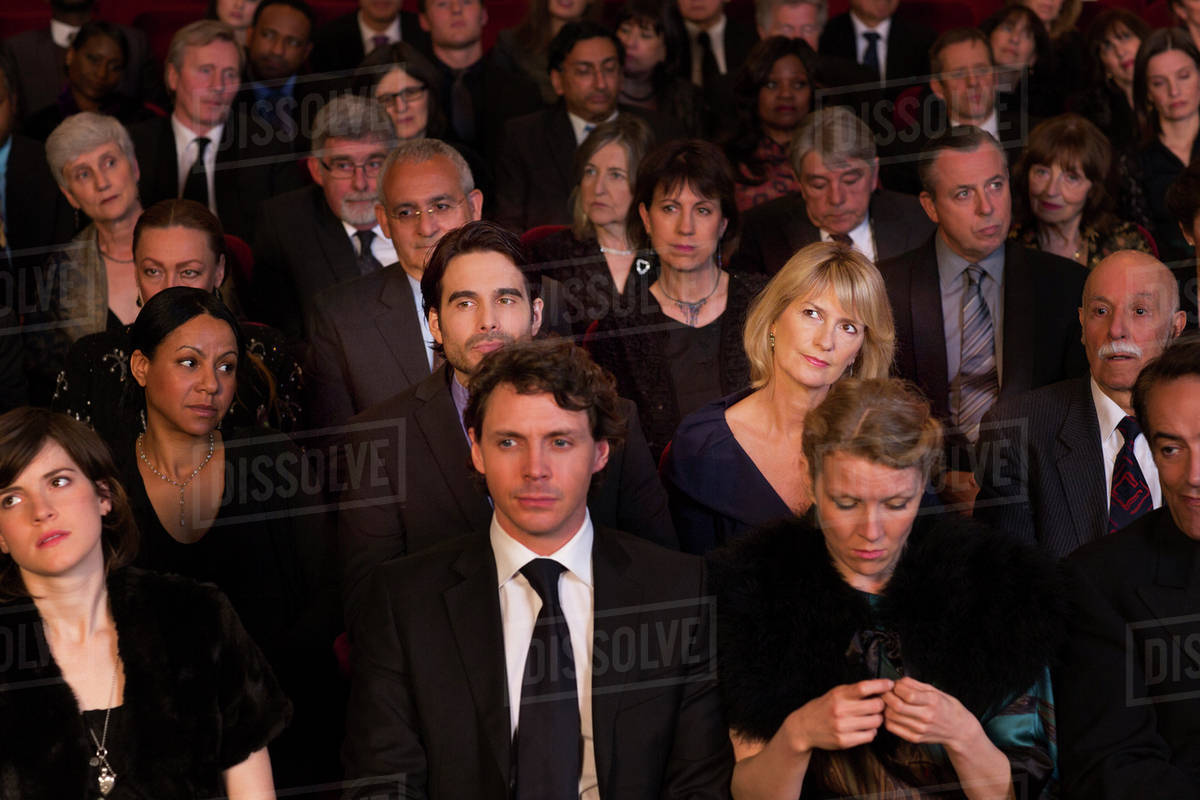 Bored woman in theater audience - Royalty-free Stock Photo | Dissolve