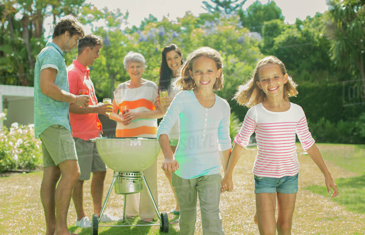 Family relaxing together in backyard - Royalty-free Stock Photo | Dissolve