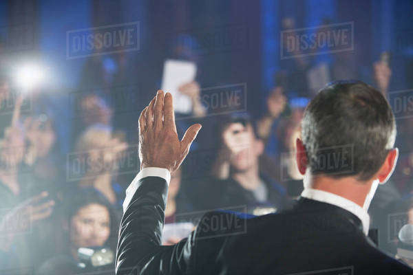 Rear view of male celebrity waving to paparazzi - Royalty-free Stock ...